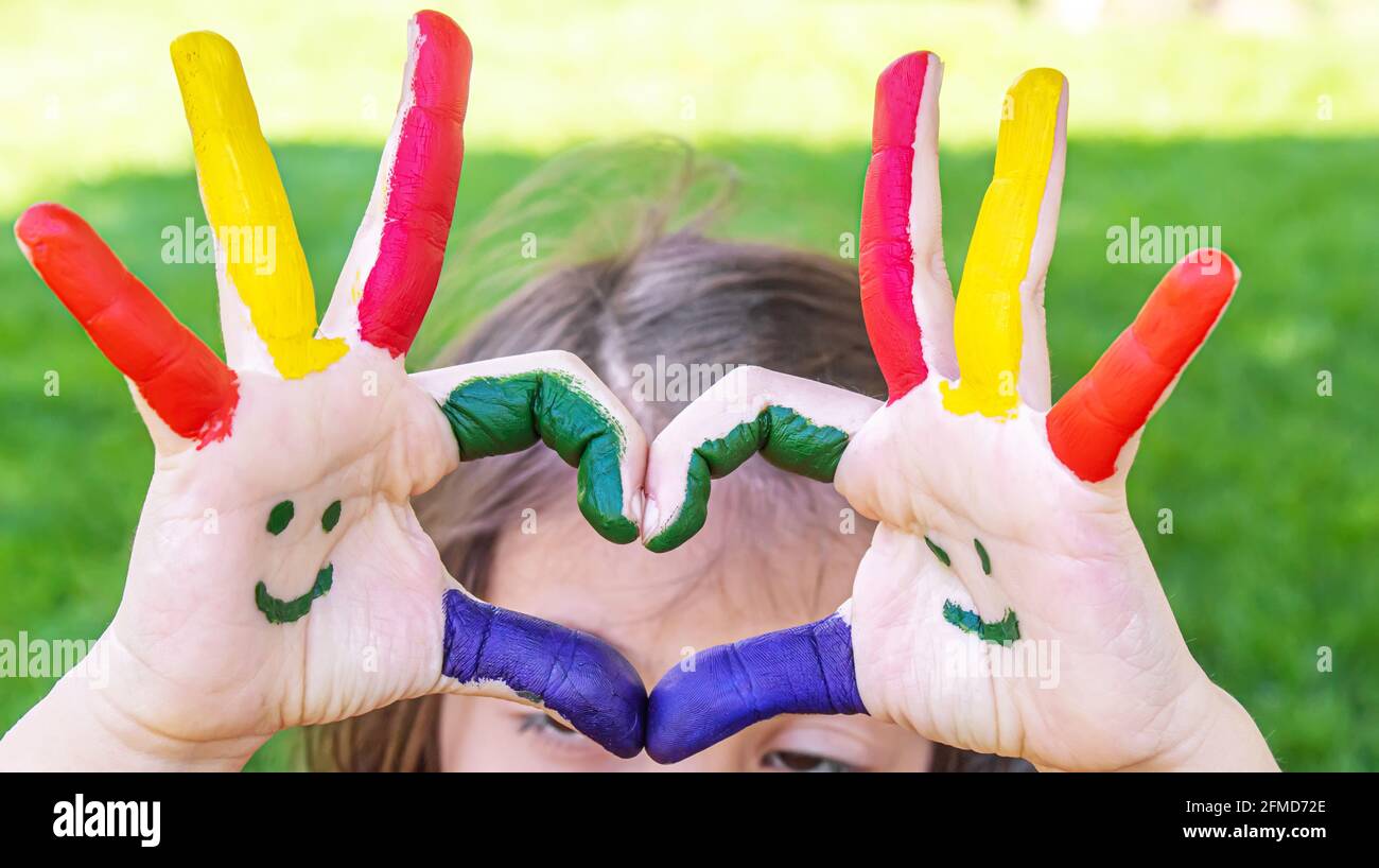 Children's hands in the colors of summer. Selective focus.nature Stock ...