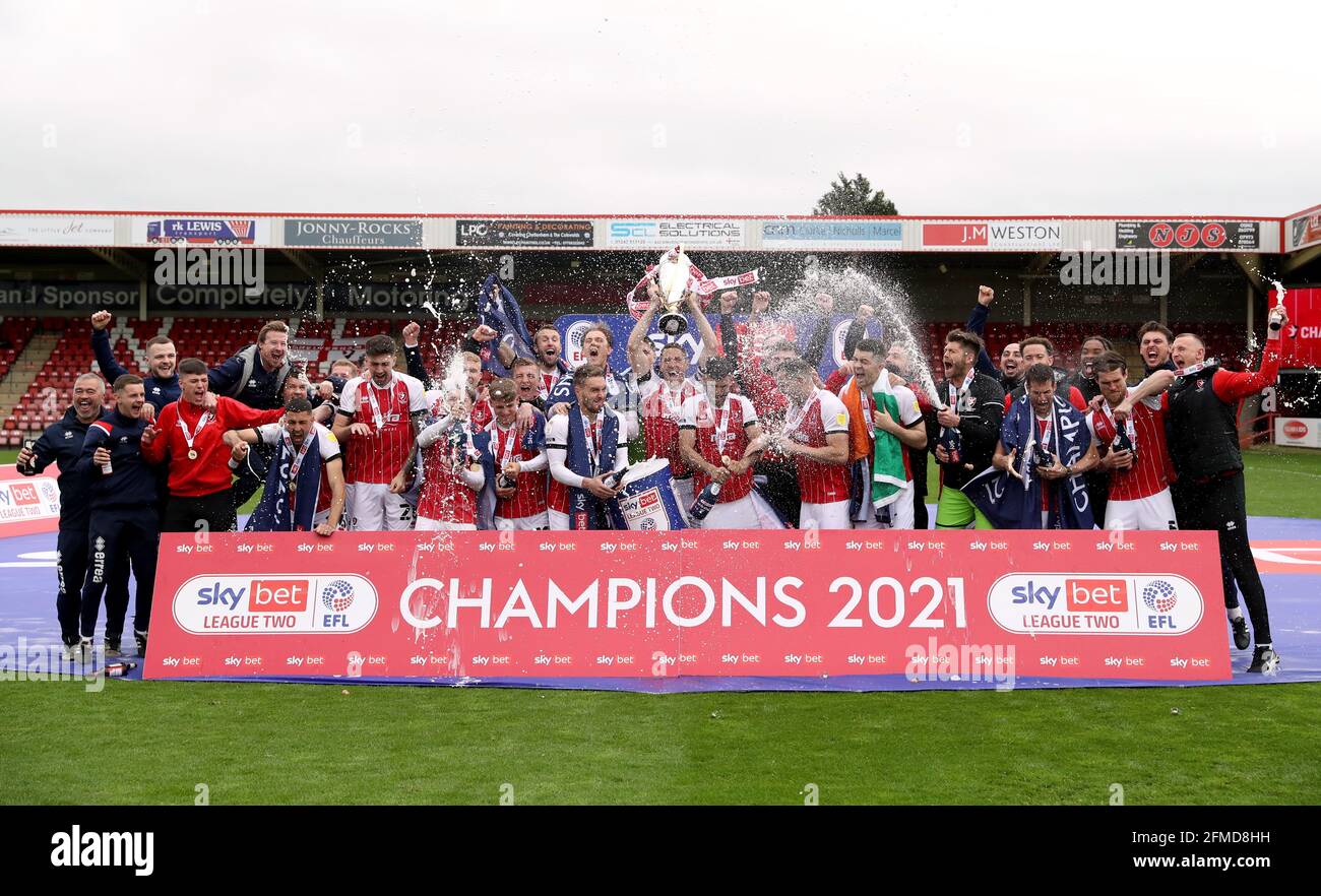 Cheltenham Town players celebrate with the League Two trophy as ...