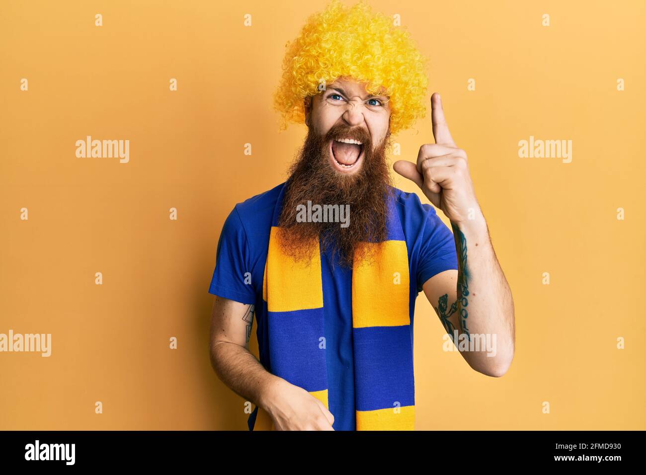 Redhead man with long beard football hooligan cheering game wearing ...