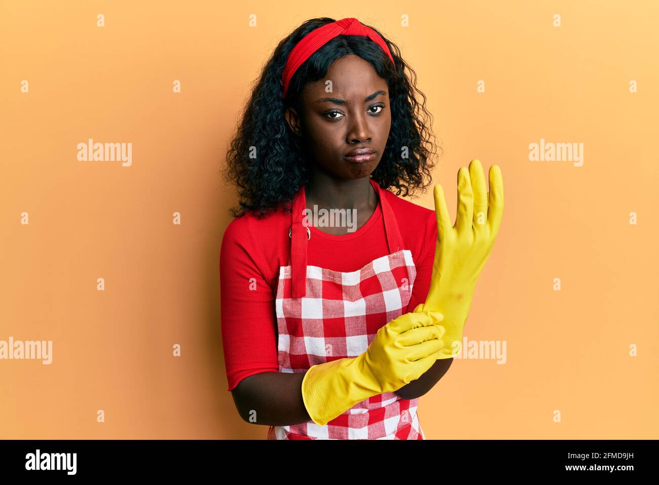 Sad black girl cleaning hi-res stock photography and images - Alamy