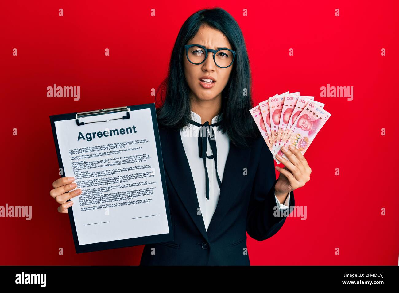 Beautiful asian young business woman holding agreement document and 100 ...