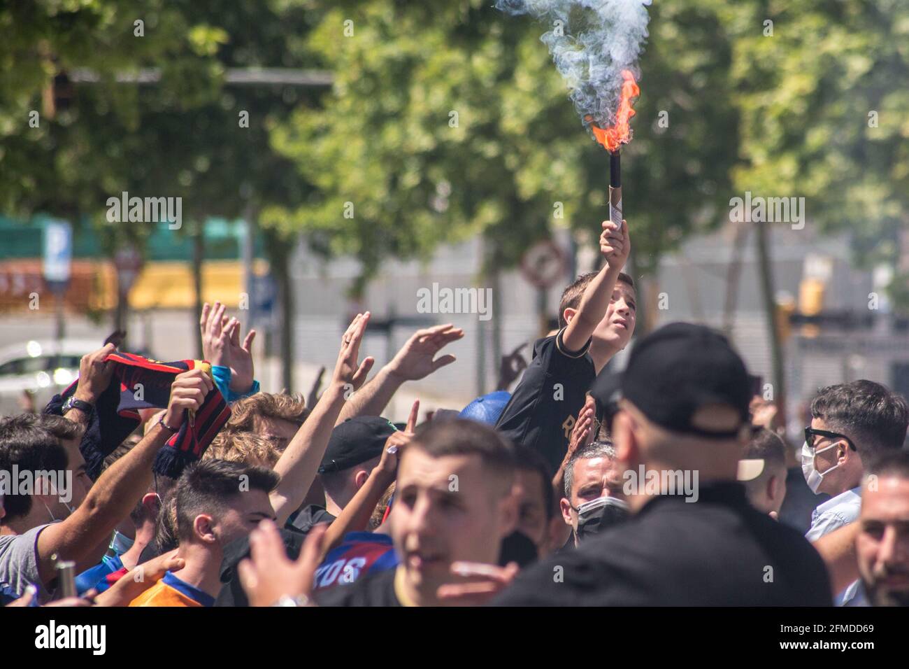 Barcelona, Spain. 08th May, 2021. Child holds a burning flare with the ...
