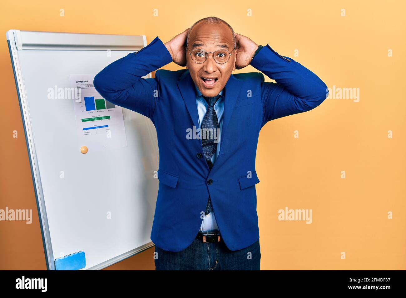 Middle age latin man wearing business clothes on chart presentation ...