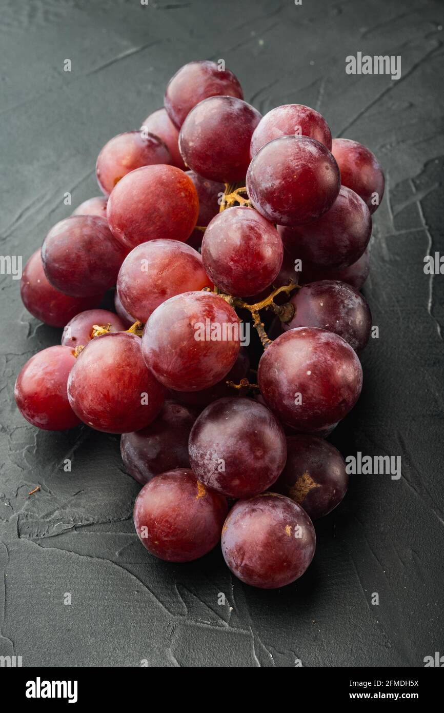 Natural organic juicy grapes set, dark red fruits, on black stone ...