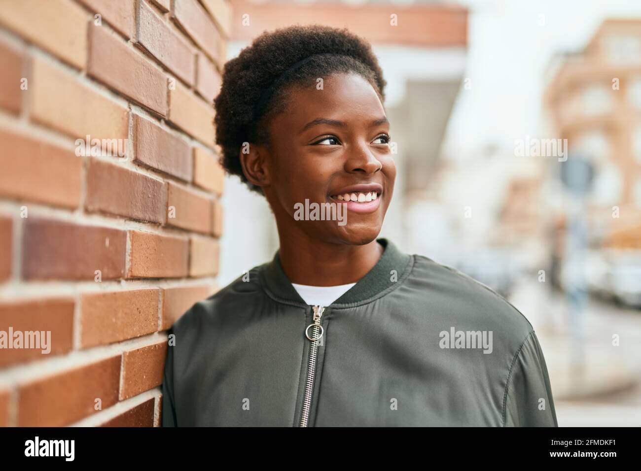 Young african american girl smiling happy standing at the city Stock ...