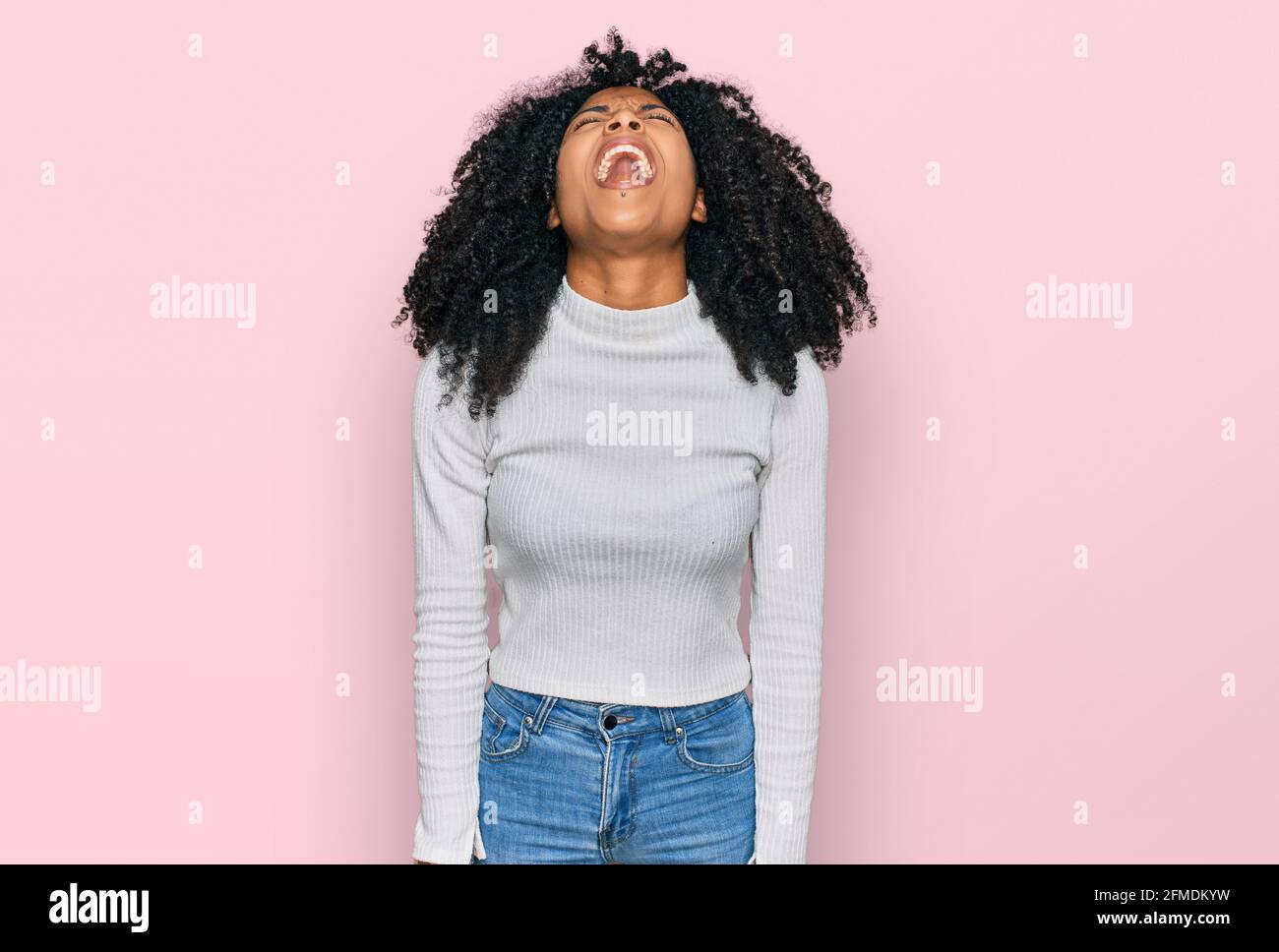 Young african american girl wearing casual clothes angry and mad ...