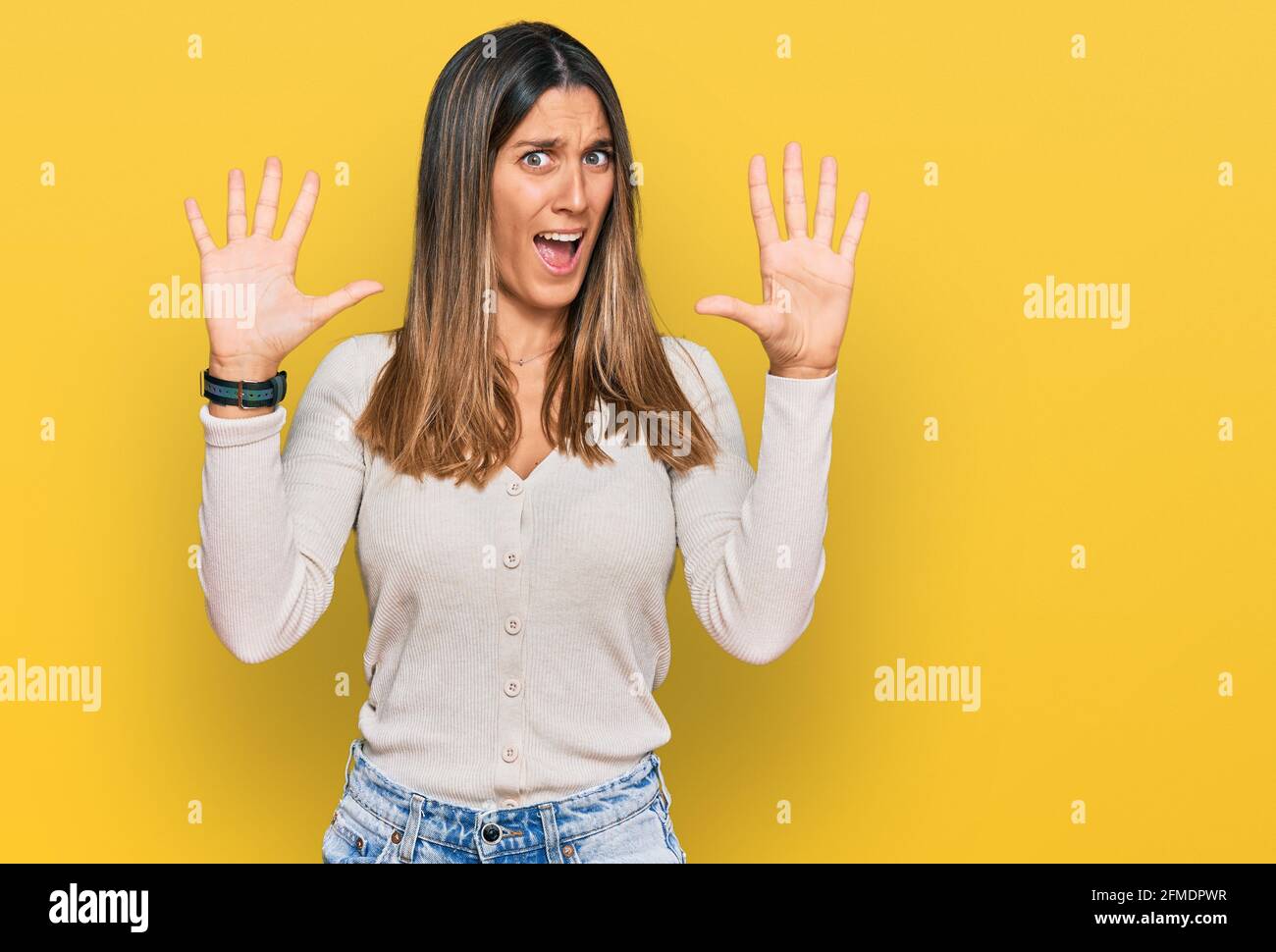 Young woman wearing casual clothes afraid and terrified with fear ...