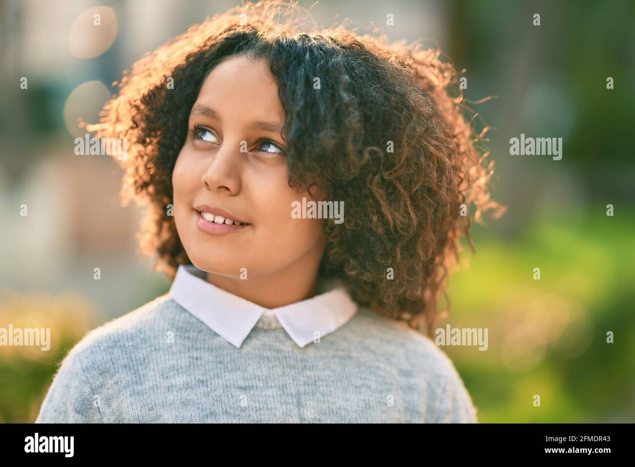 Adorable hispanic child girl smiling happy standing at the park Stock ...