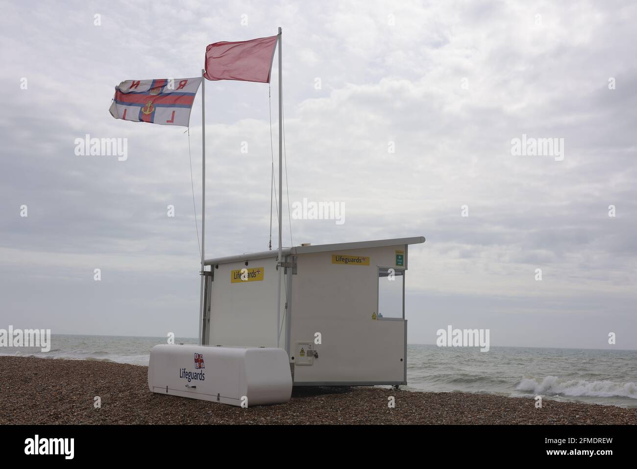Cabin of Bognor Regis lifeguards with two flags Stock Photo - Alamy