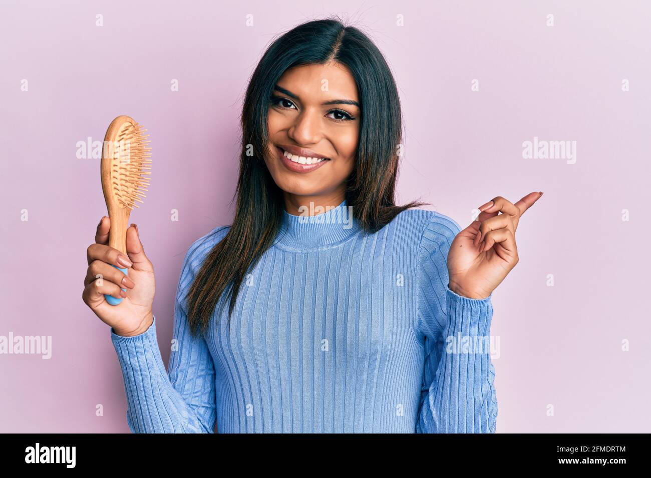 Young Latin Transsexual Transgender Woman Holding Hairbrush Smiling