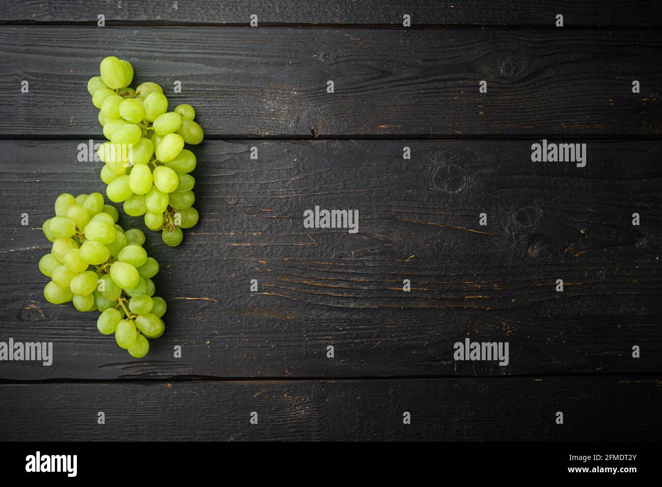 Shine Grape fruit set, green fruits, on black wooden table, top view ...
