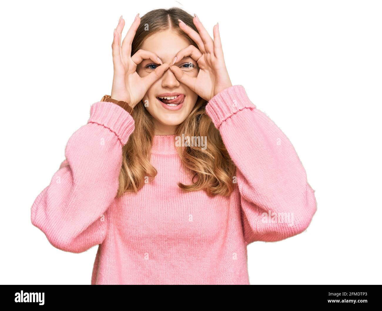 Beautiful young caucasian girl wearing casual winter sweater doing ok ...