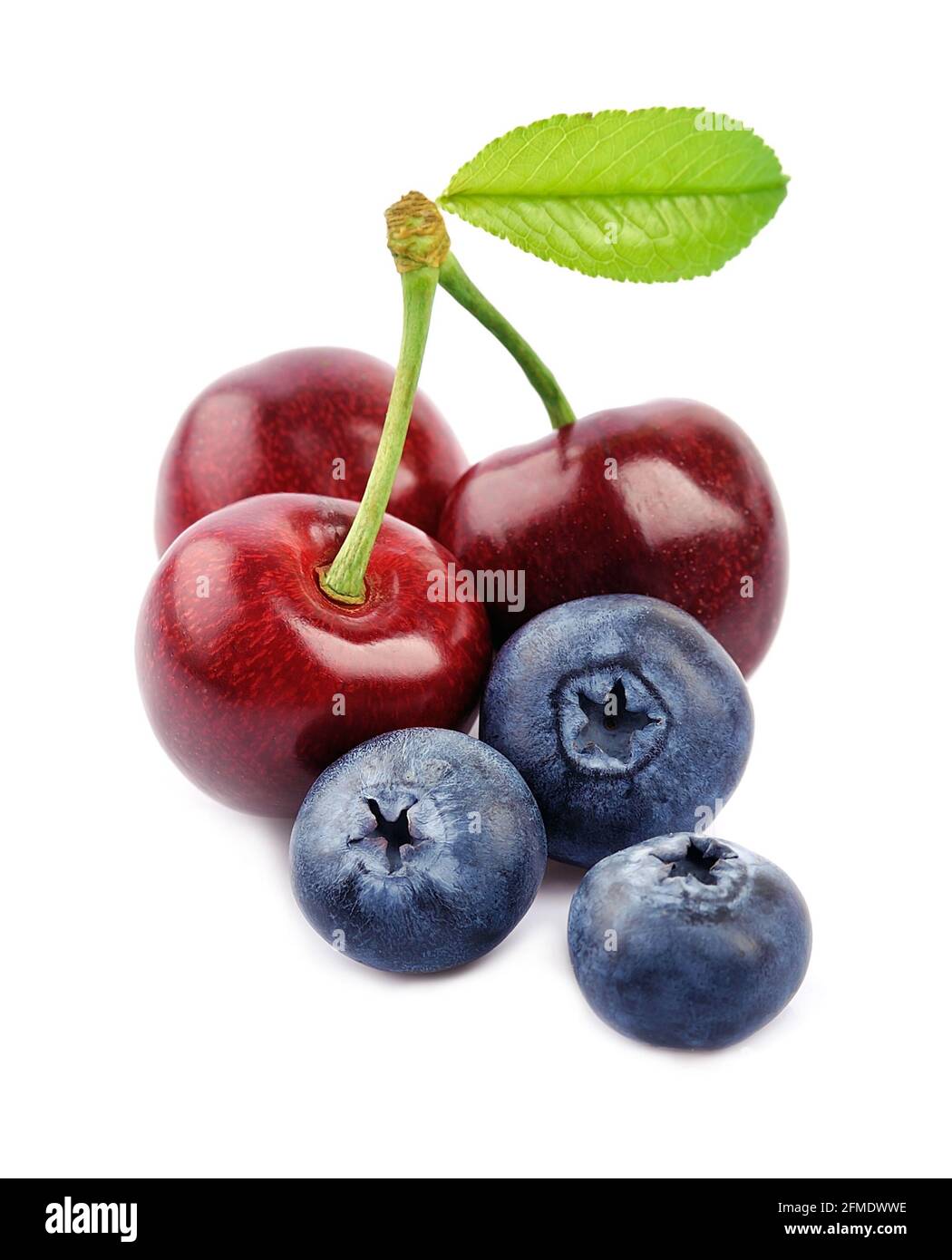Sweet cherry fruits with blueberries close up on white backgrounds ...