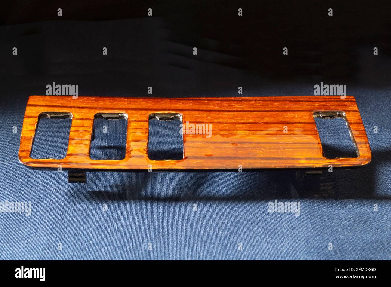 Veneering of parts with veneer for the car interior. Decorative details ...