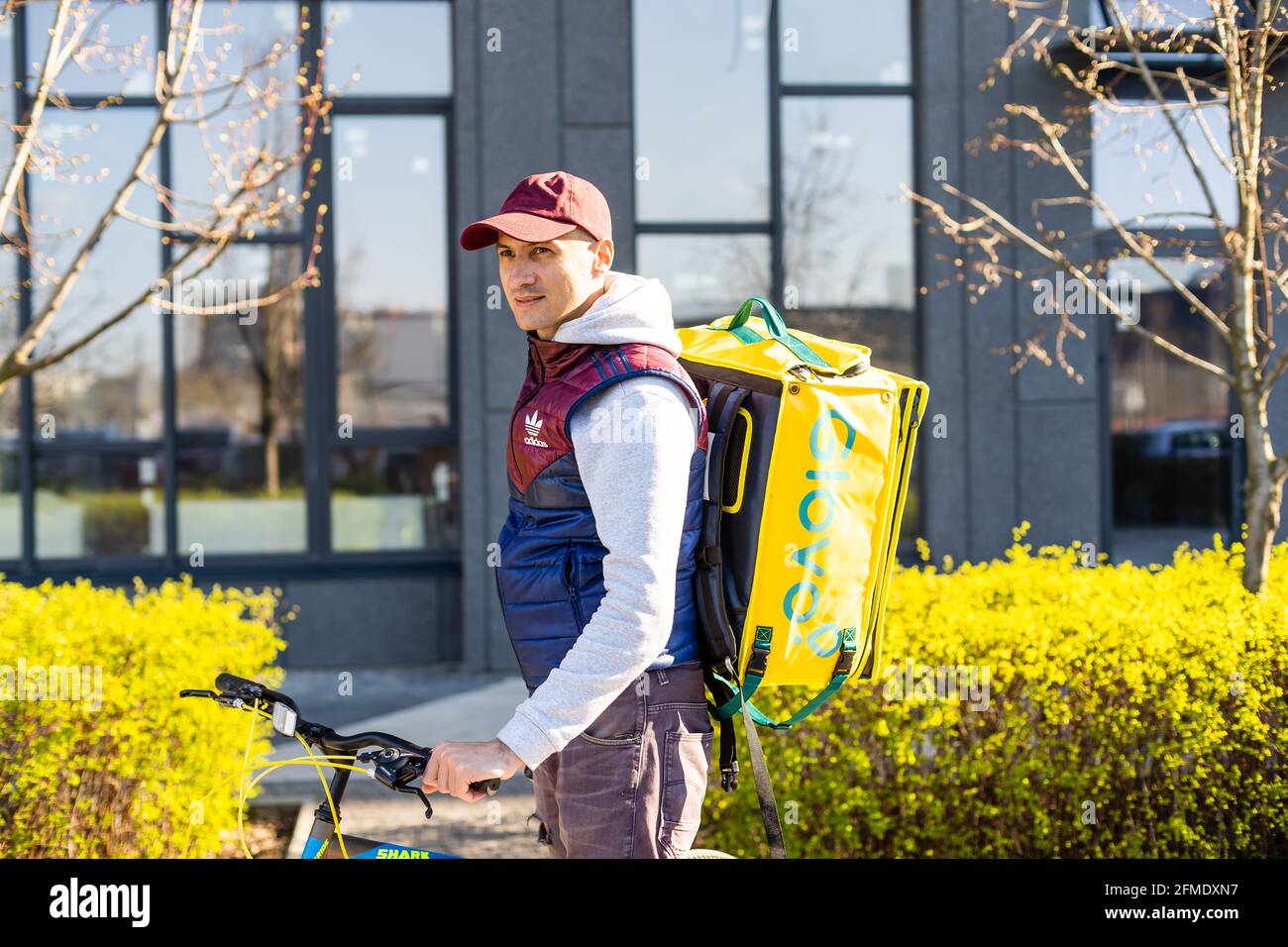 KIEV, UKRAINE - April 28, 2021: Glovo bike courier on the street ...