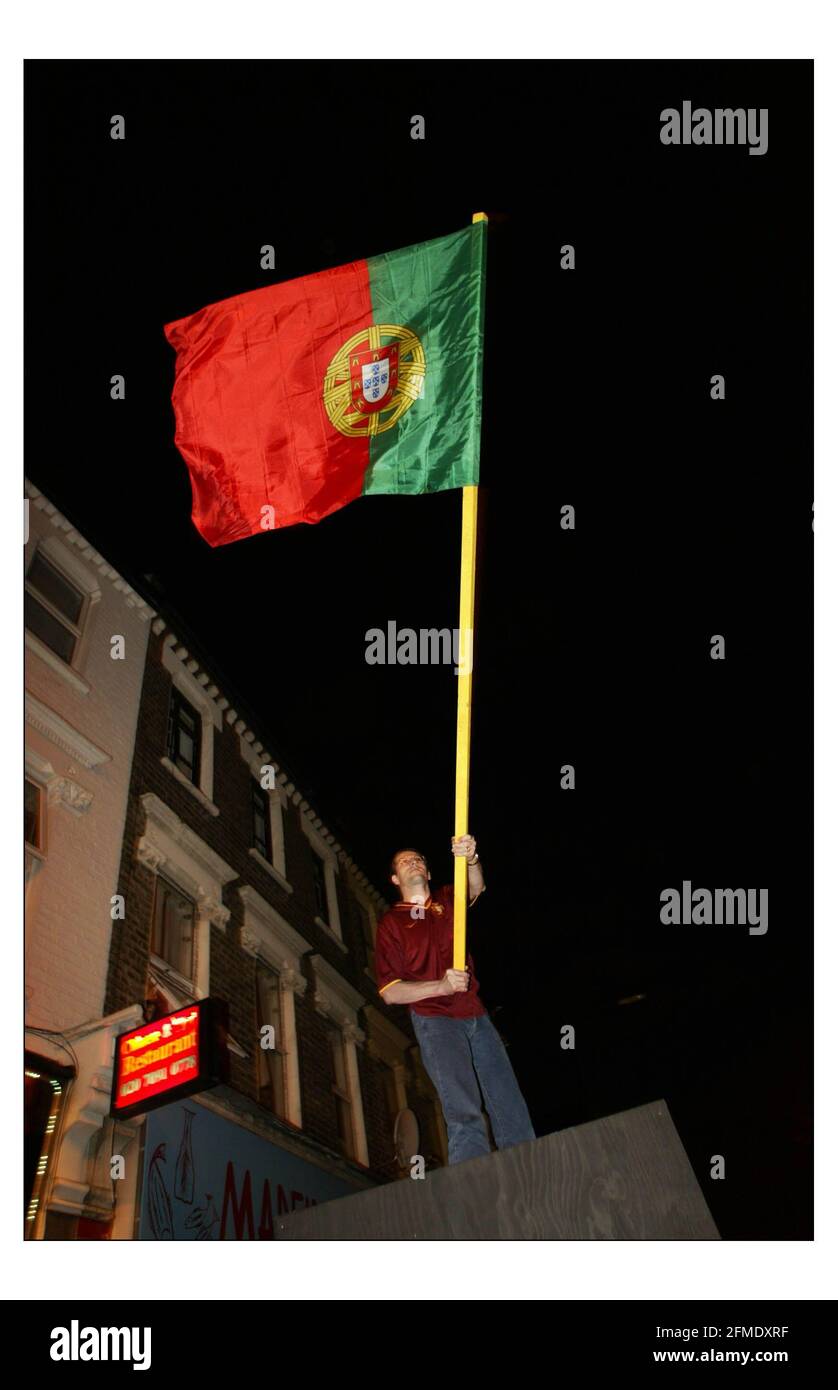 Portugese fans celebrate their win against England in Euro 2004 outside ...