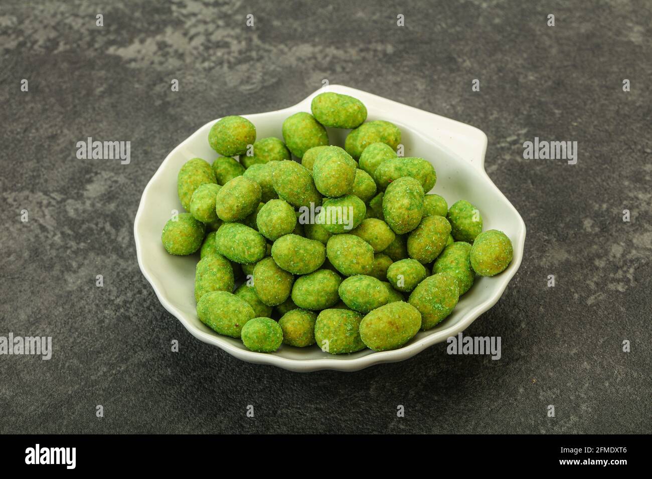 Spicy wasabi peanuts snack in the bowl Stock Photo - Alamy