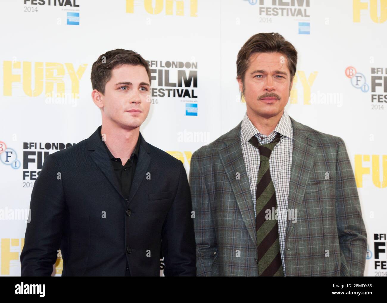 Logan Lerman and Brad Pitt attend the Fury photocall at The Corinthia ...