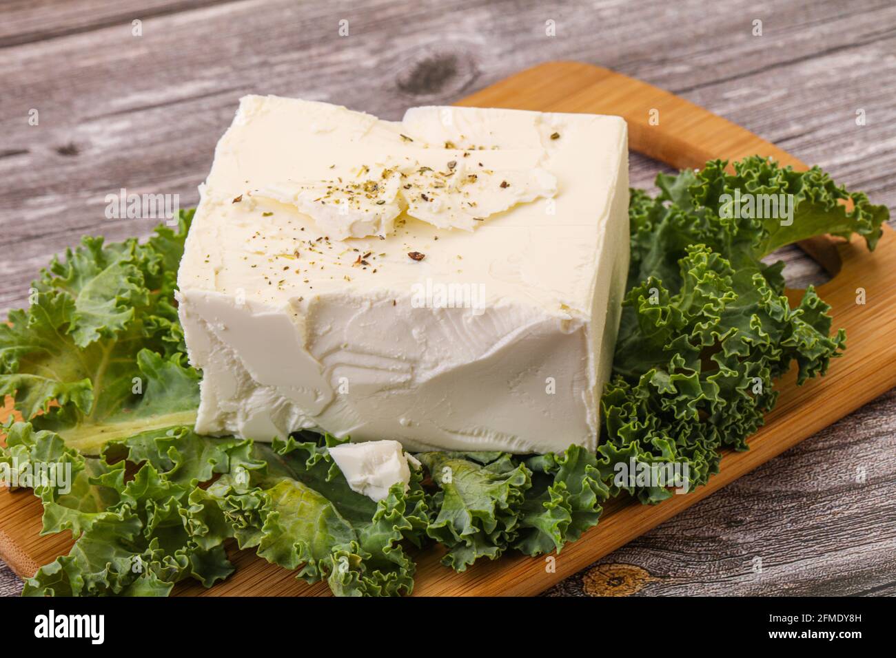 Traditional tasty Greek Feta soft cheese brick Stock Photo - Alamy