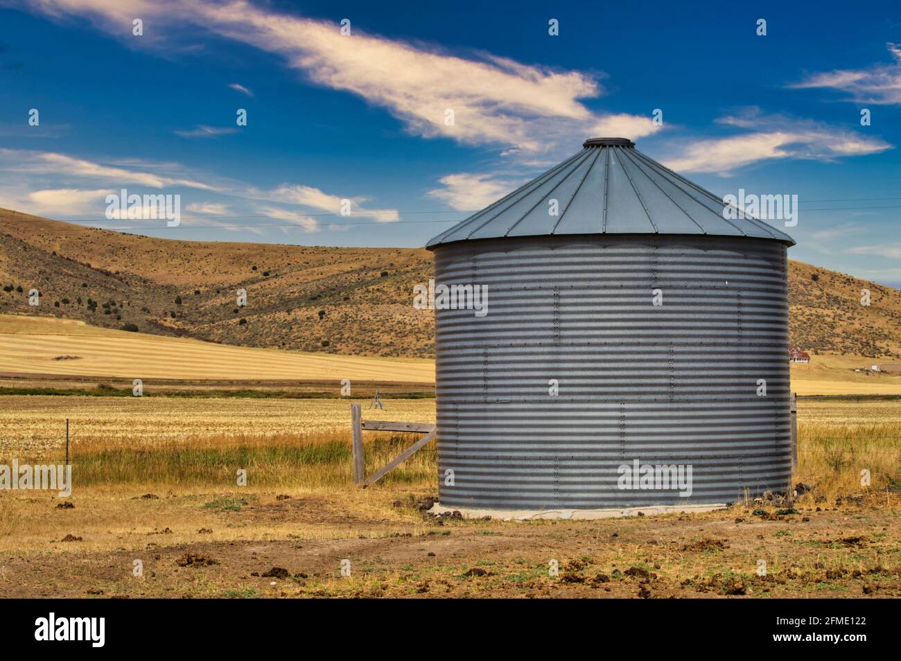 Silo container in an open field Stock Photo - Alamy