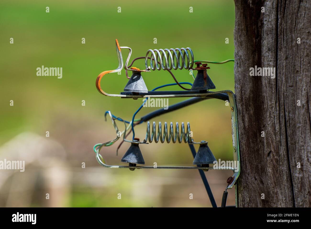 Power lines on an old fence Stock Photo - Alamy