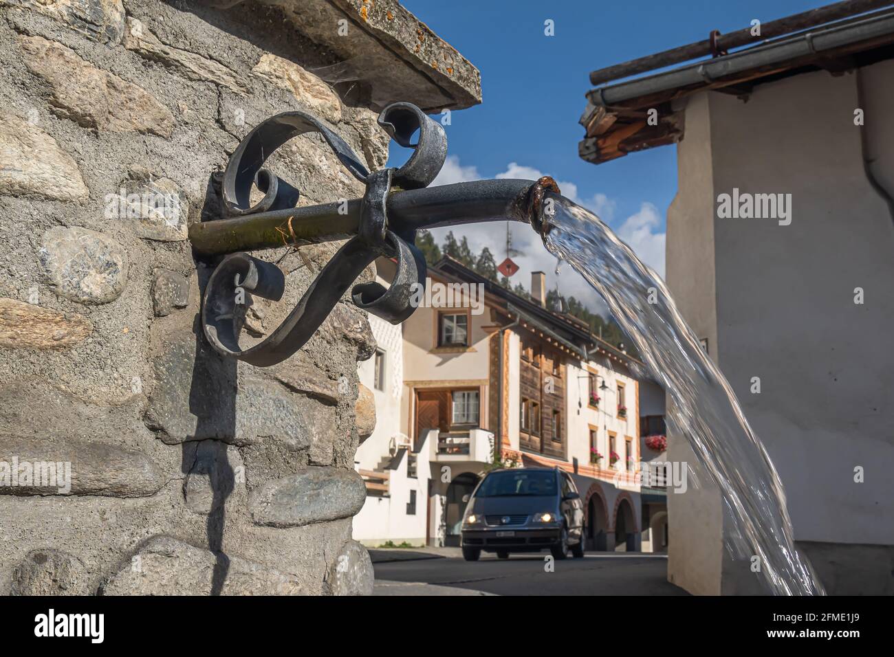 Mustair, Switzerland - September 8, 2020: Water fountain in the village ...