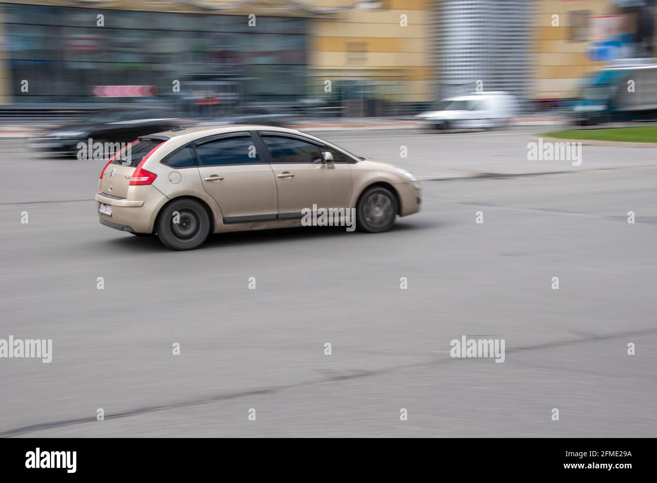 Ukraine, Kyiv - 26 April 2021: Beige Citroen C4 car moving on the ...