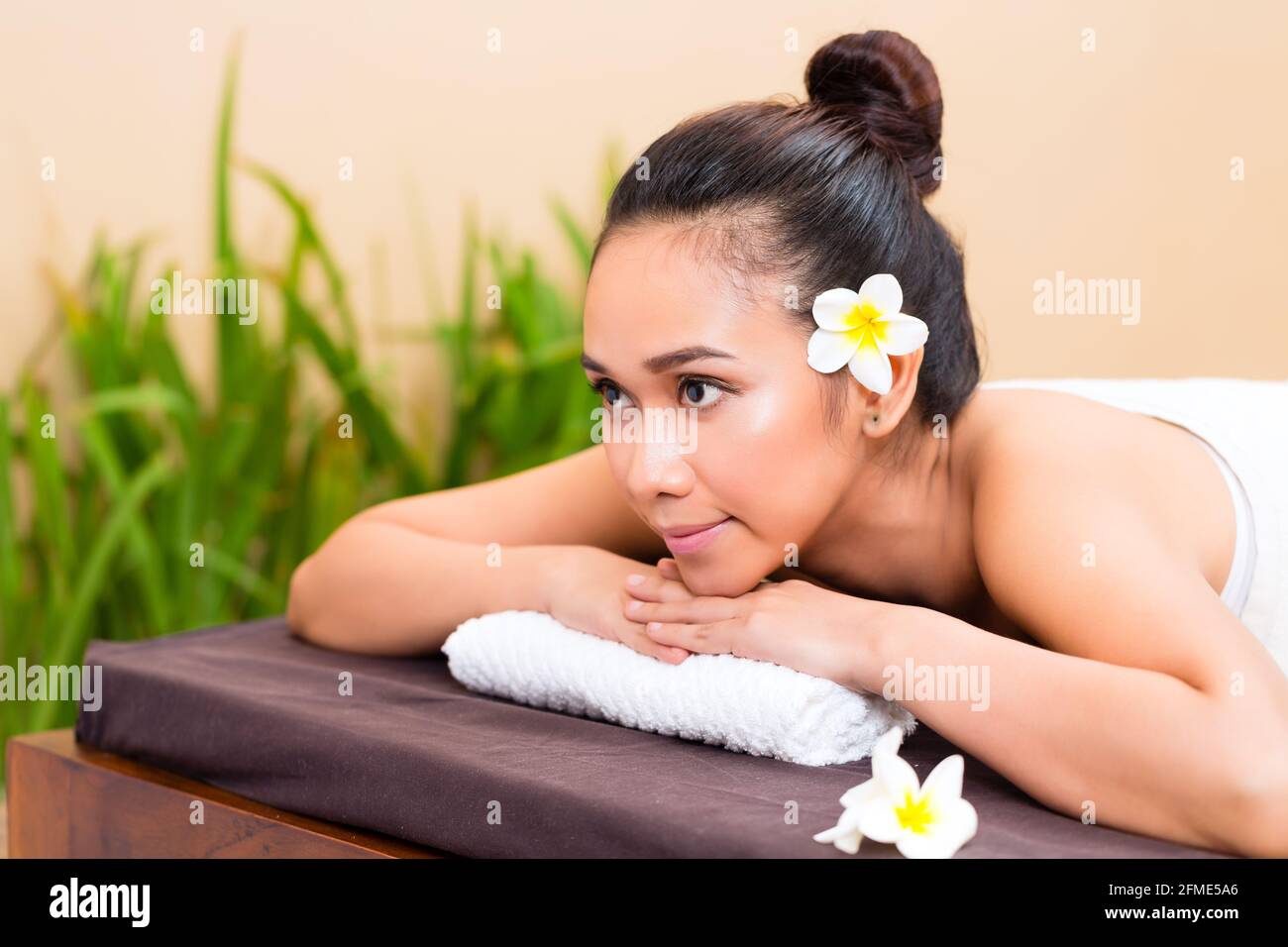 Indonesian Asian woman in wellness beauty day spa looking relaxed Stock ...