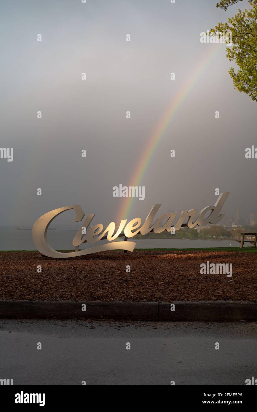 Cleveland script sign with rainbow from edgewater park with cityscape ...