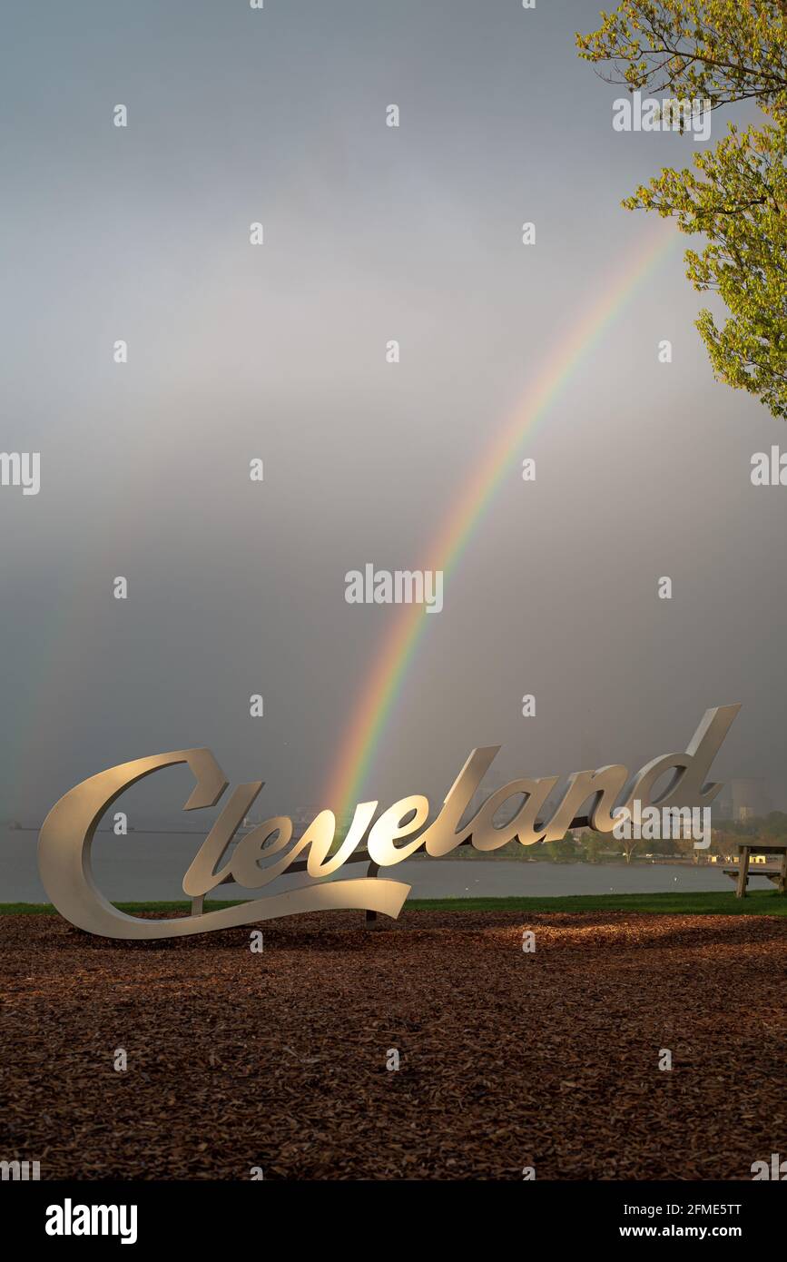 Cleveland script sign with rainbow from edgewater park with cityscape ...