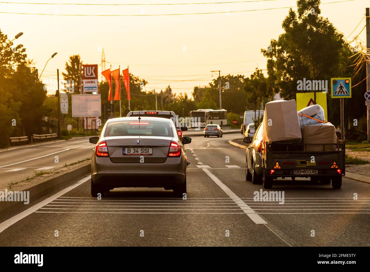 Car traffic at rush hour. Traffic jam, cars on the road at sunset in ...