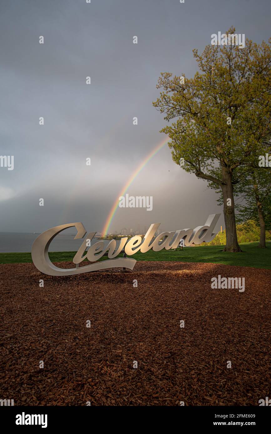 Cleveland script sign with rainbow from edgewater park with cityscape ...