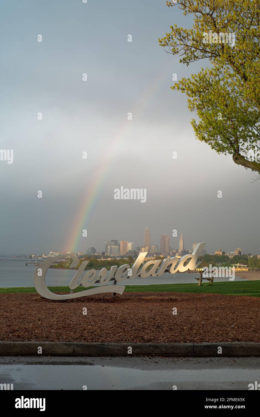 Cleveland script sign with rainbow from edgewater park with cityscape ...