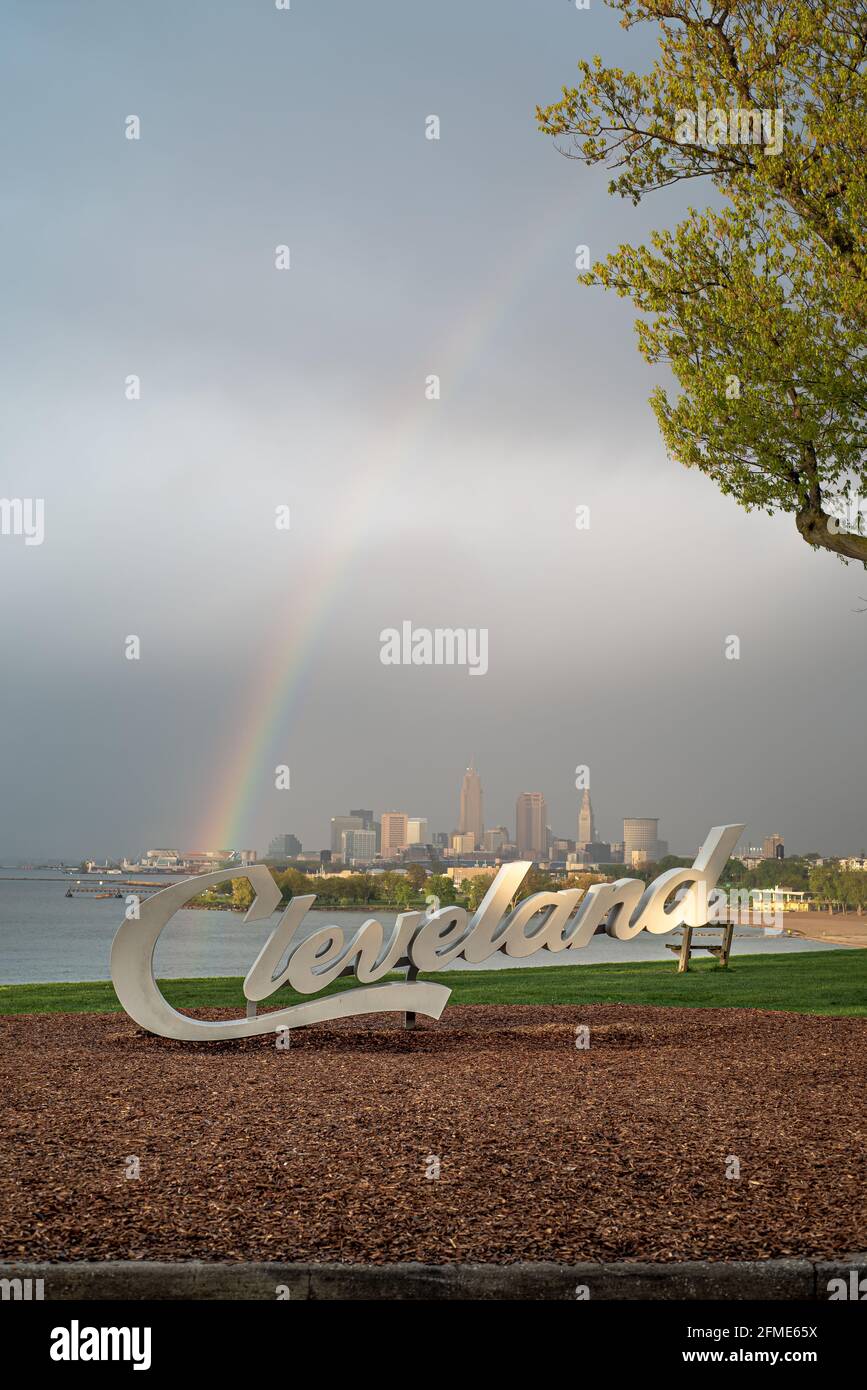 Cleveland script sign with rainbow from edgewater park with cityscape ...
