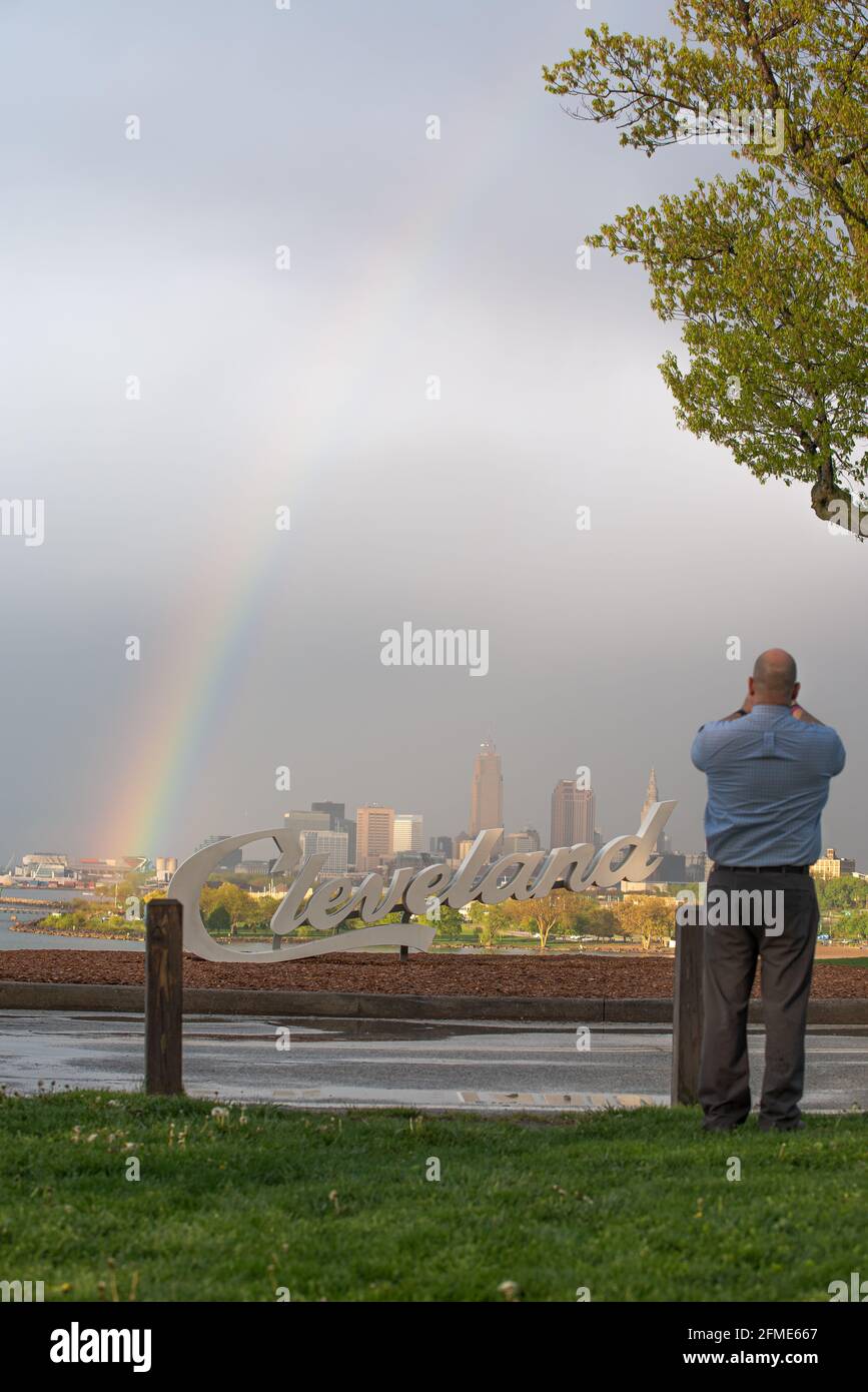 Cleveland script sign with rainbow from edgewater park with cityscape ...