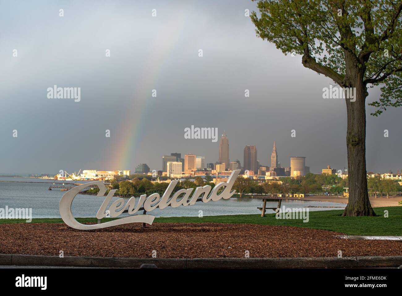 Cleveland script sign with rainbow from edgewater park with cityscape ...