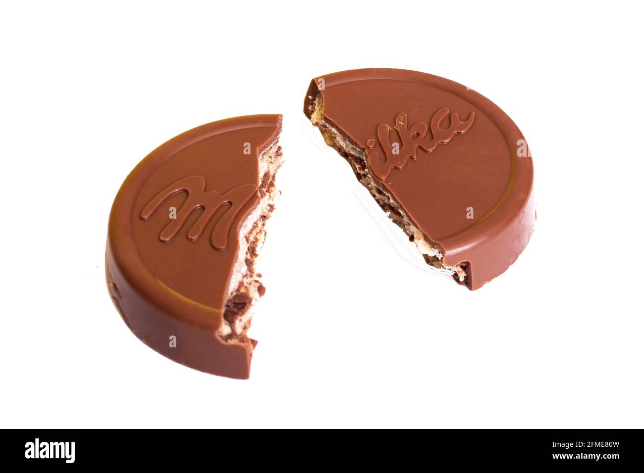 Brocken round waffle milka isolated on white background Stock Photo - Alamy