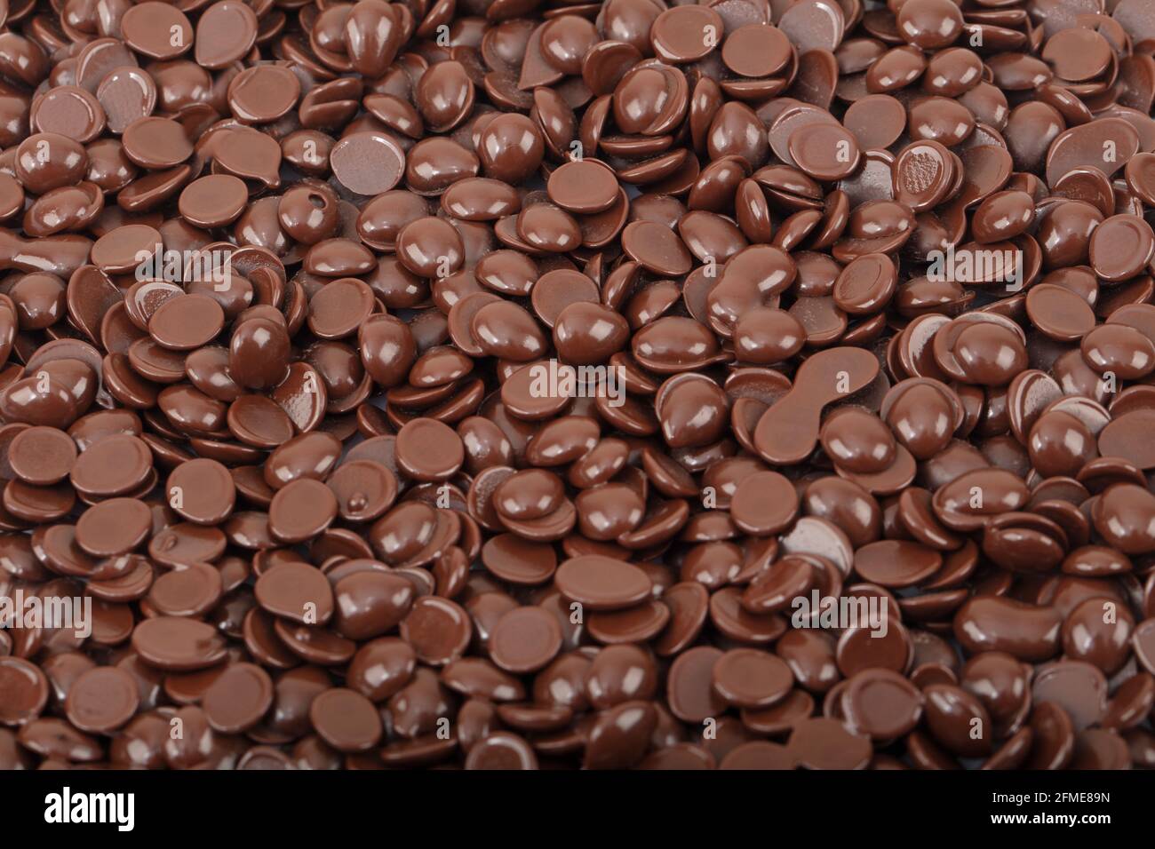 Pile of Dark chocolate chips isolated on white background Stock Photo ...