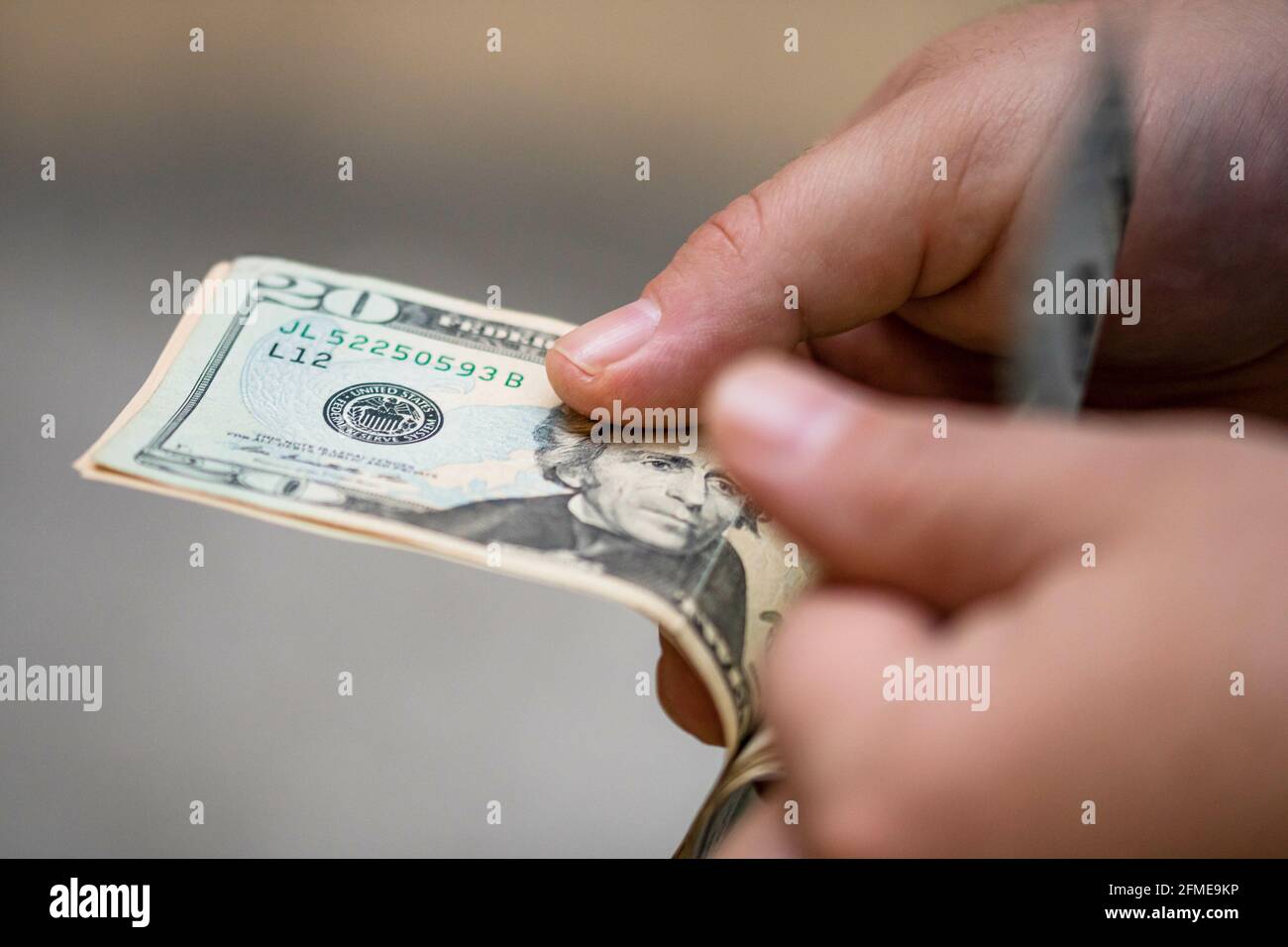 Closeup of male hands counting USD banknotes - world money, inflation ...