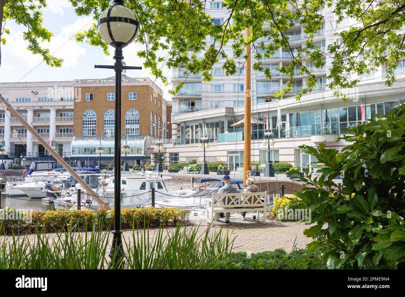 Couple seated boats yachts moorings hotels development chelsea m hi-res ...