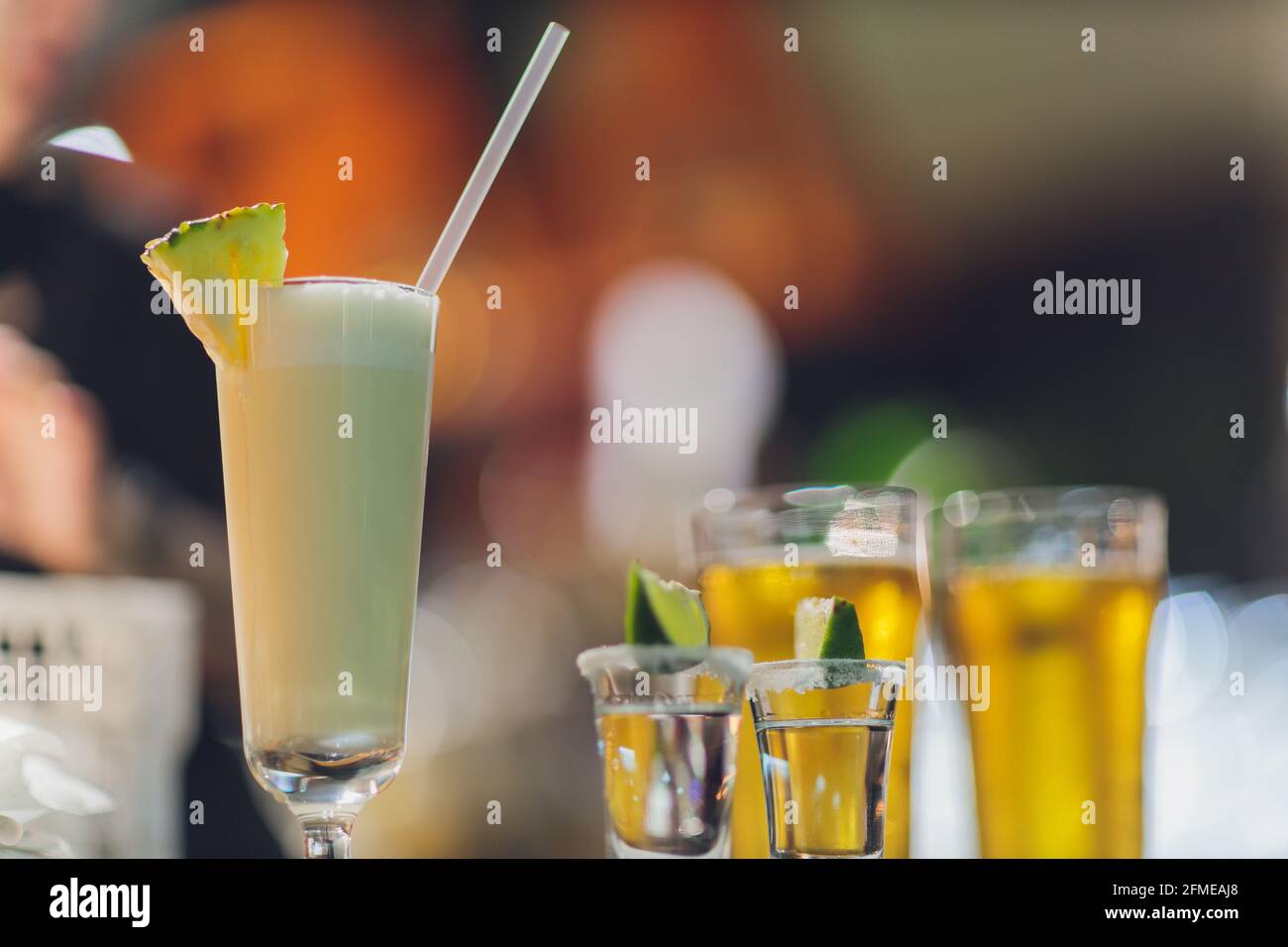 Two shots of tequila and a pair of lemon pieces Stock Photo - Alamy