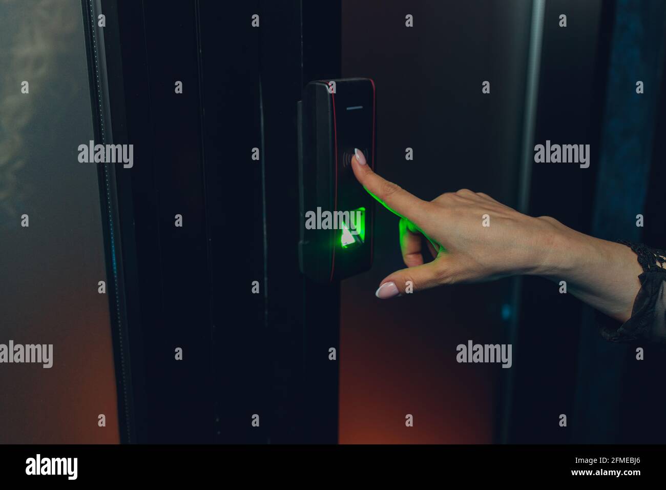 Closeup of a woman's finger entering password code on the smart digital ...
