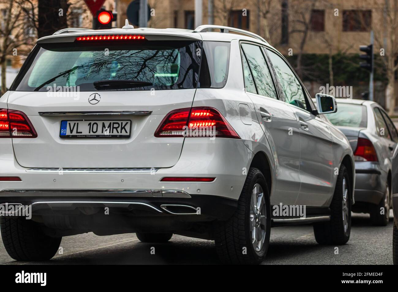 White Mercedes back view suv in traffic in Bucharest, Romania, 2021 ...