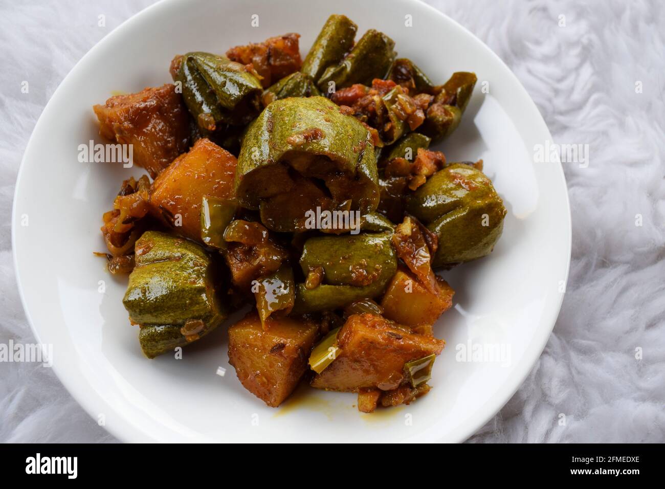 Parwal aloo ki sabji also known as Pointed gourd and potato fry curry ...