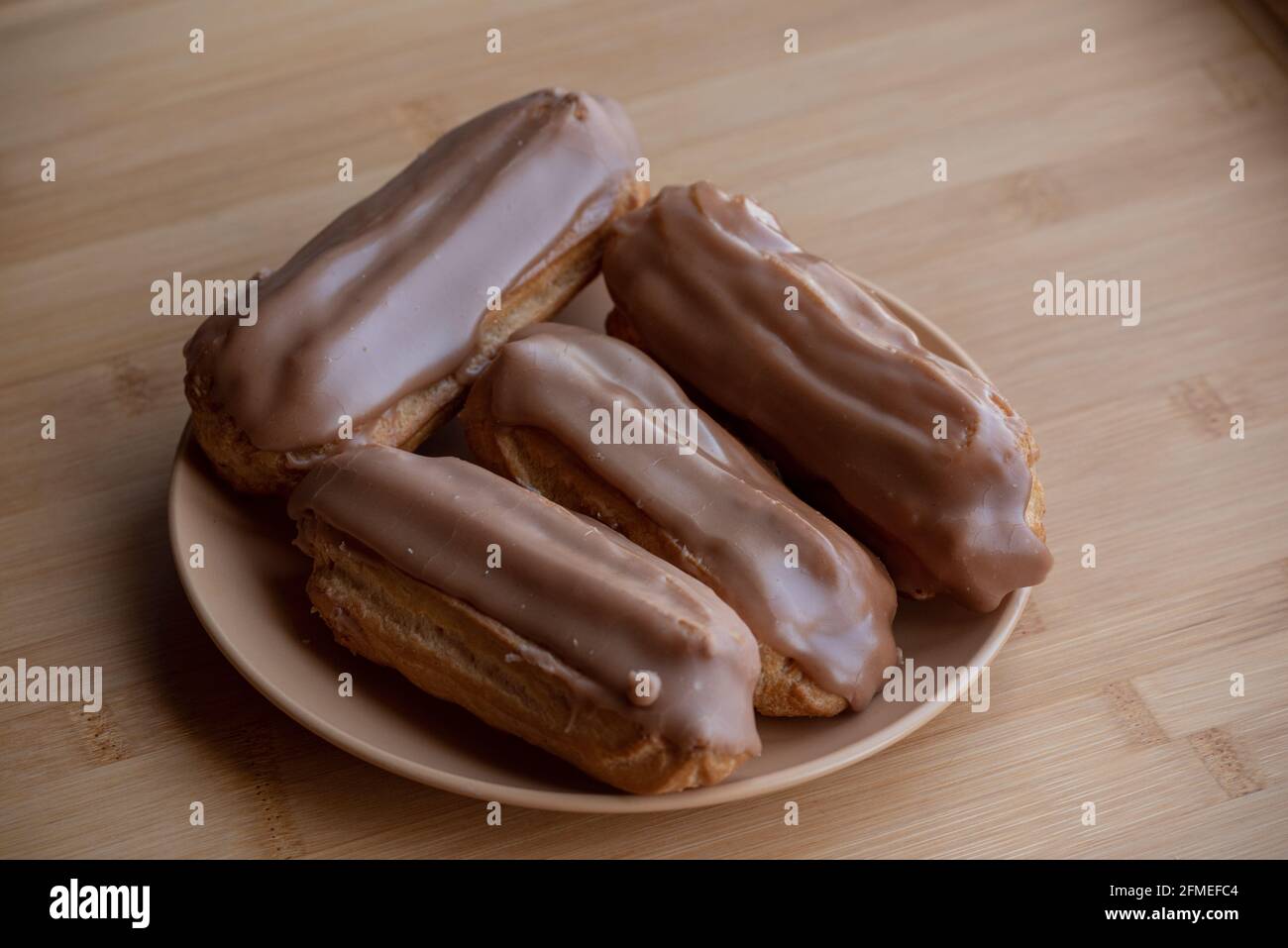 fatty sweet food. Cakes on a beige plate on the table. plate, snack ...