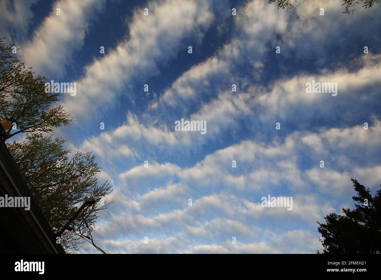 Shot of blue sky with wavy clouds Stock Photo - Alamy