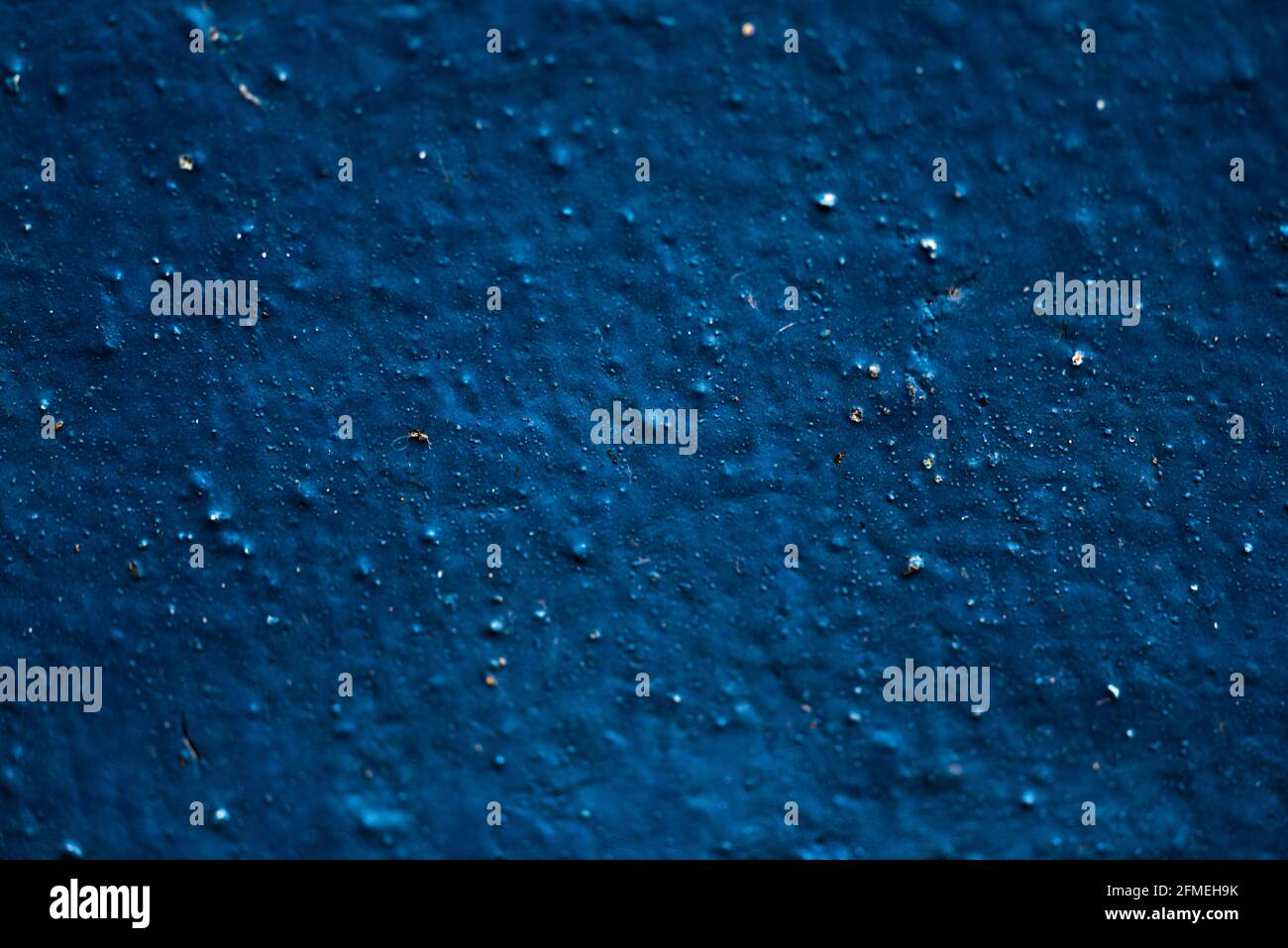 Grain blue dribbled paint wall background or texture. Wide Background ...