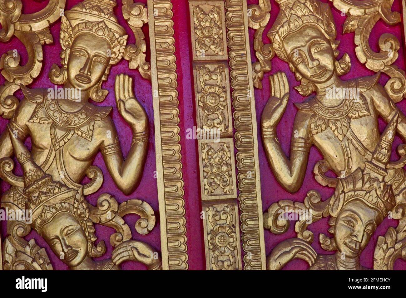Closeup of painted door on temple with colorful spiritual design Luang ...