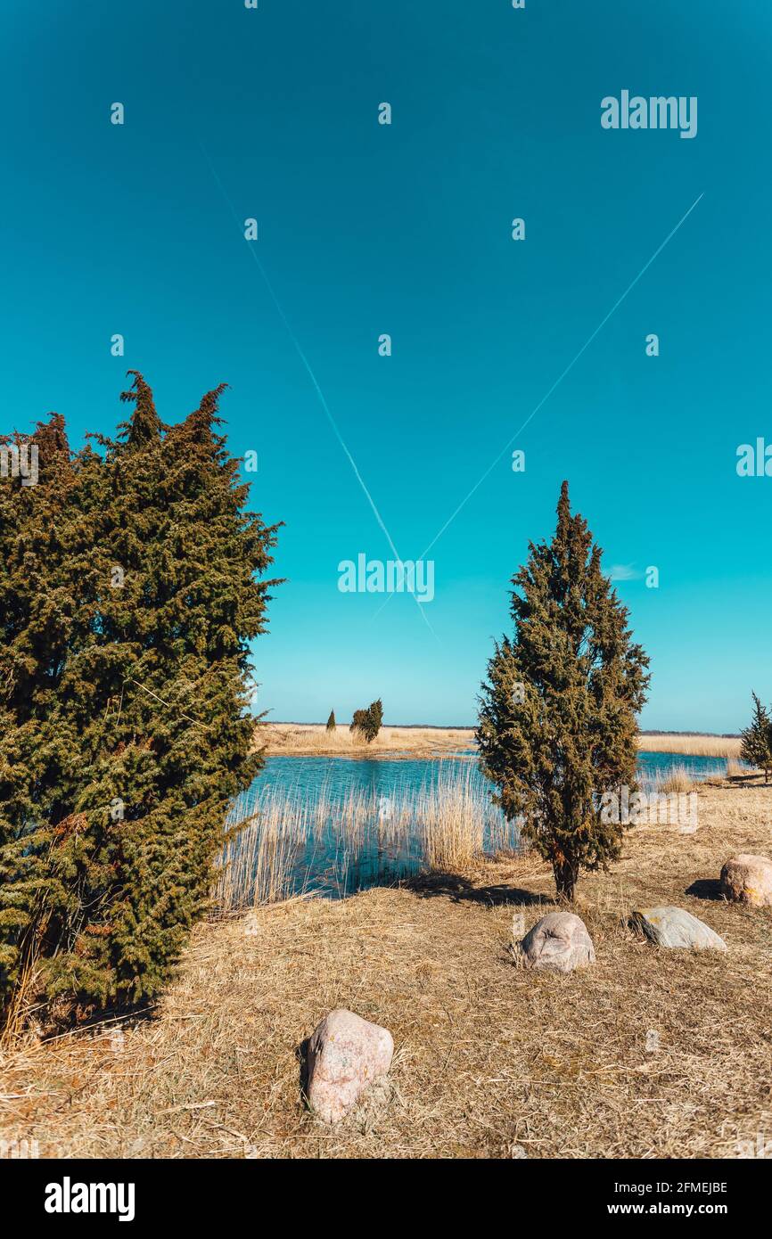 National park view, calm lake with airplane trails in the shape of X ...