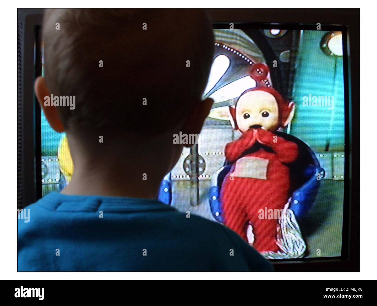 Oliver Bennett watching Tv with his son Bruno.pic David Sandison 30/10 ...